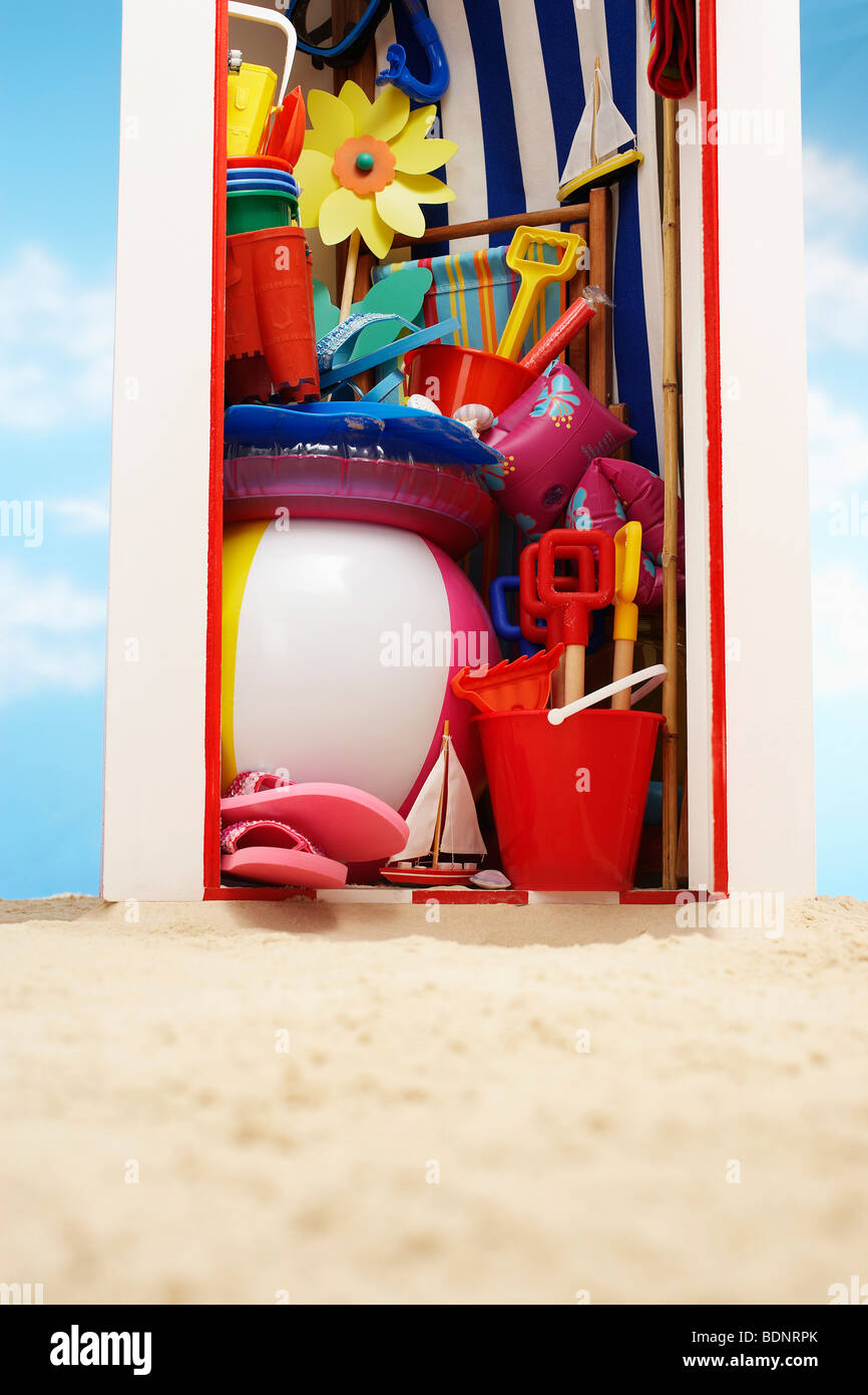 Beach storage cabin with beach toys Stock Photo - Alamy