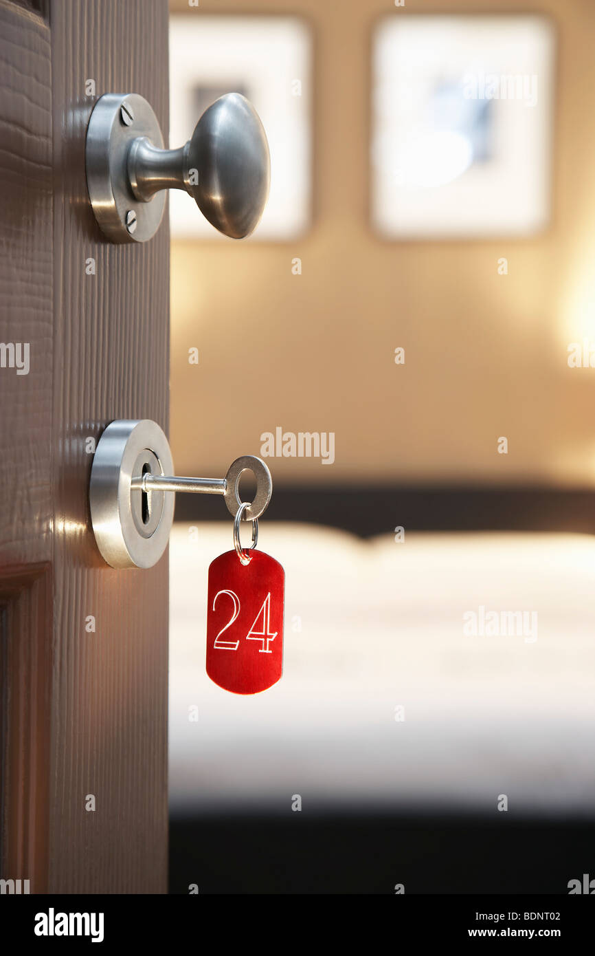 Key in hotel room's door Stock Photo - Alamy