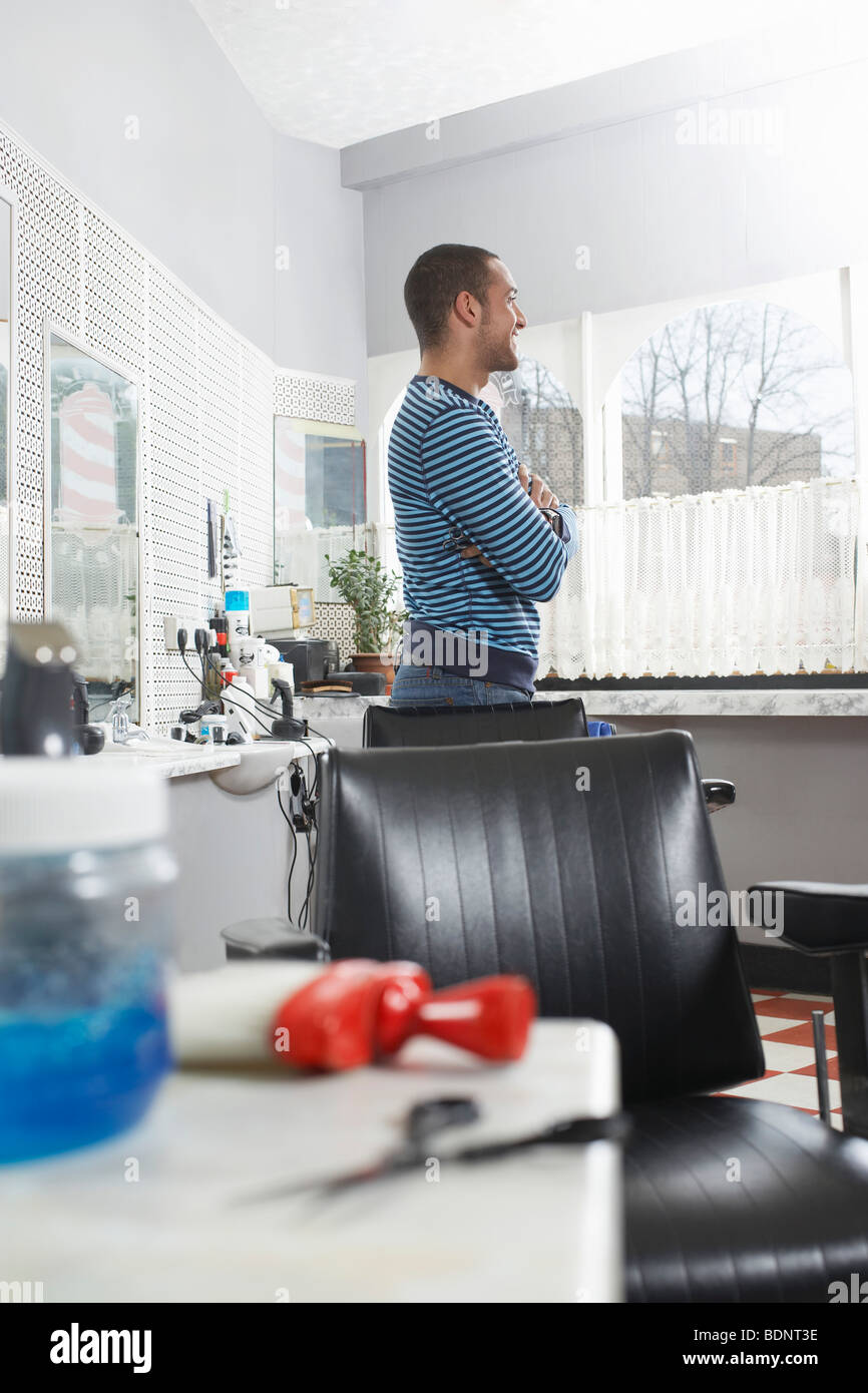 Man standing in barbers shop Stock Photo - Alamy