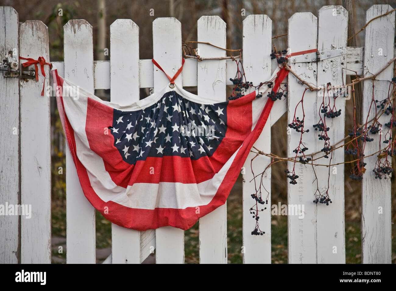 The US flag hung on a picket gate Stock Photo - Alamy