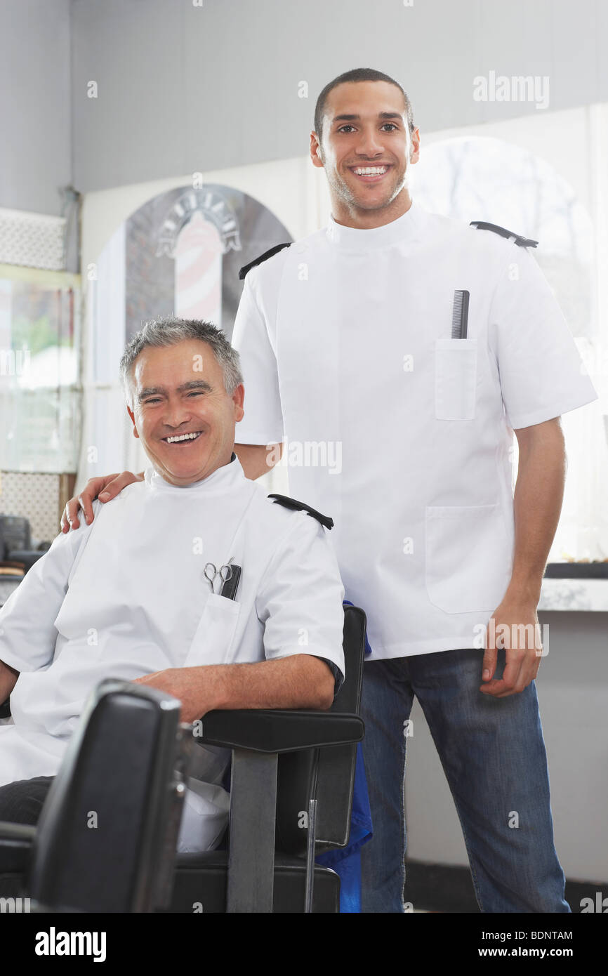 Two barbers in barber shop, portrait Stock Photo - Alamy