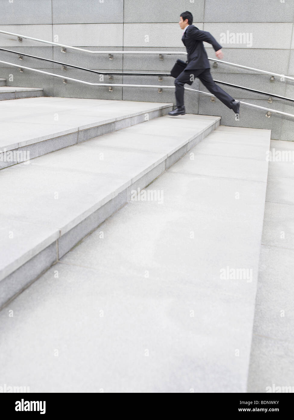 Man running steps suit hi-res stock photography and images - Alamy
