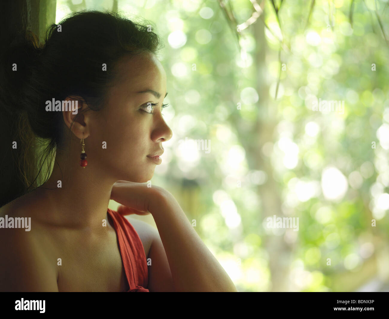 Portrait of young woman looking at trees, profile Stock Photo - Alamy