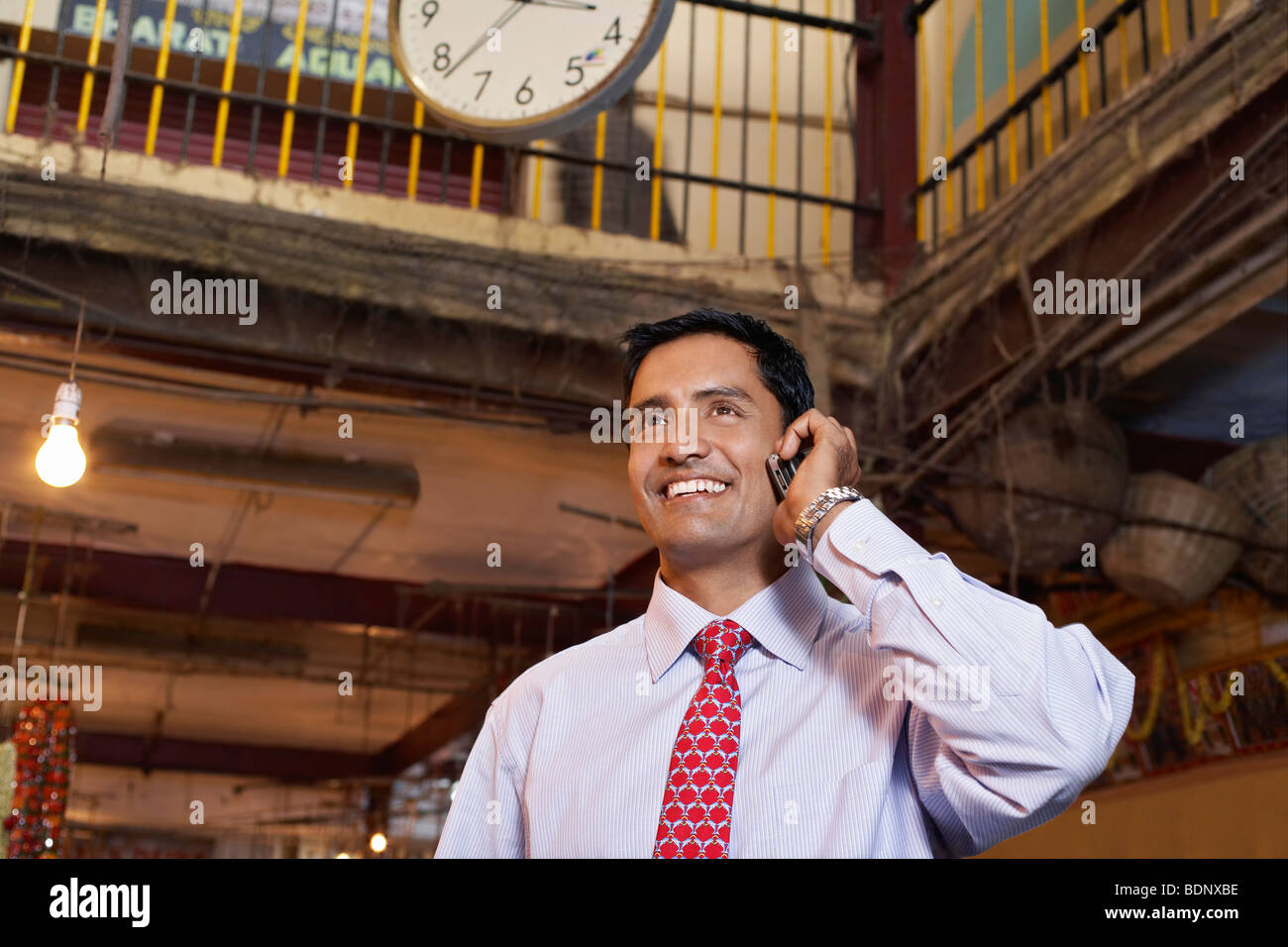Business man floating away on umbrella above city Stock Photo - Alamy