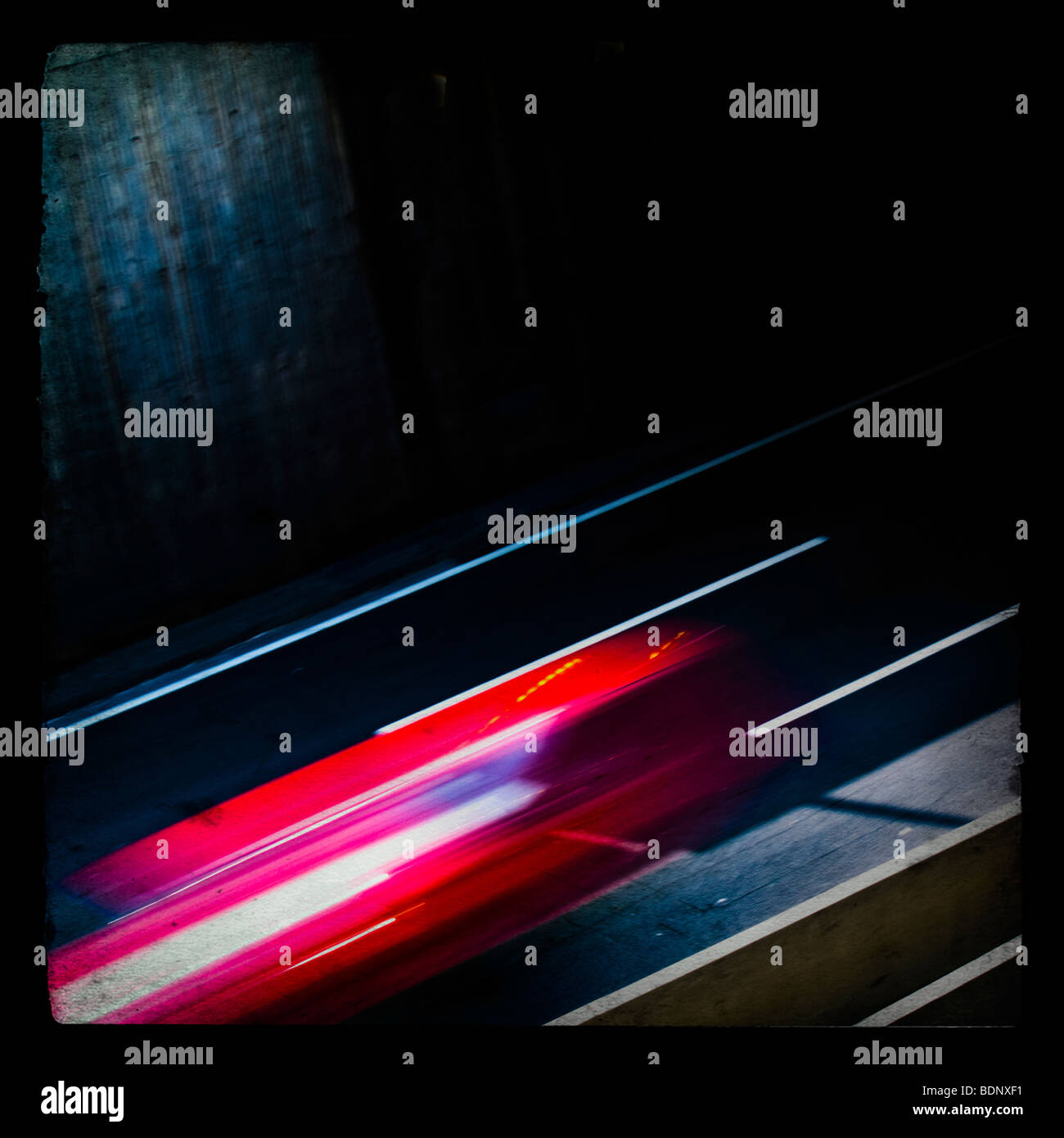 A red car moving fast Stock Photo - Alamy