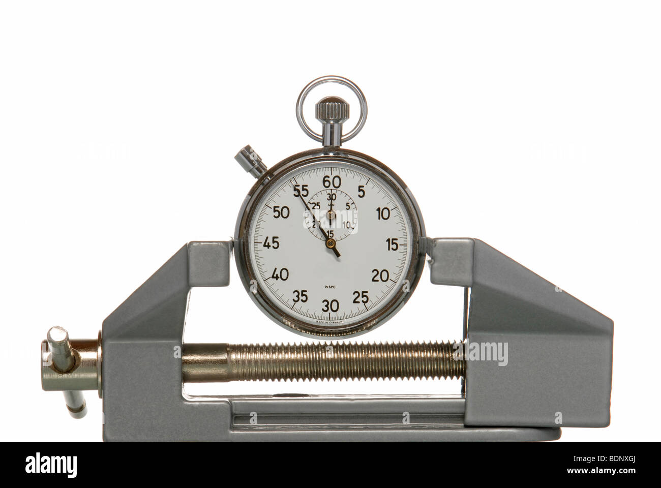 Stopwatch pinched in a vice, symbolic image for time pressure Stock ...