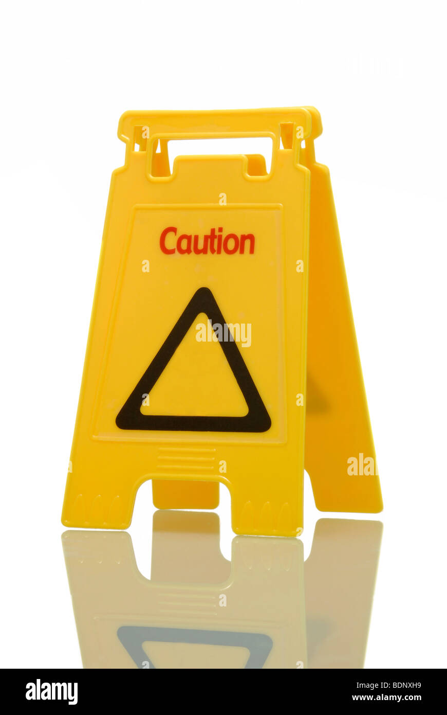Safety sign labeled caution, symbolic for caution, slippery when wet ...