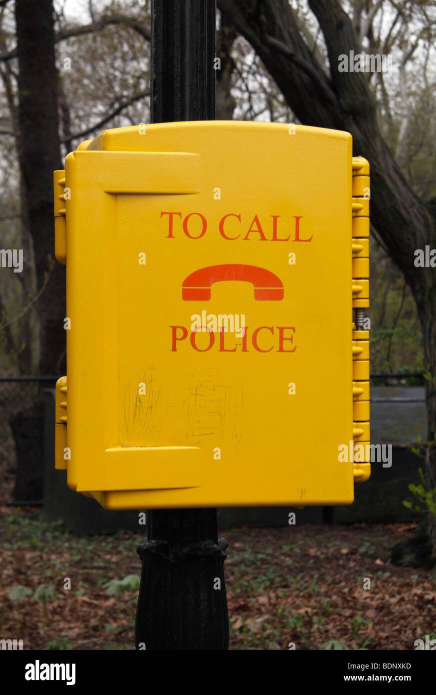 A bright yellow emergency Police phone box inside Central Park, New ...