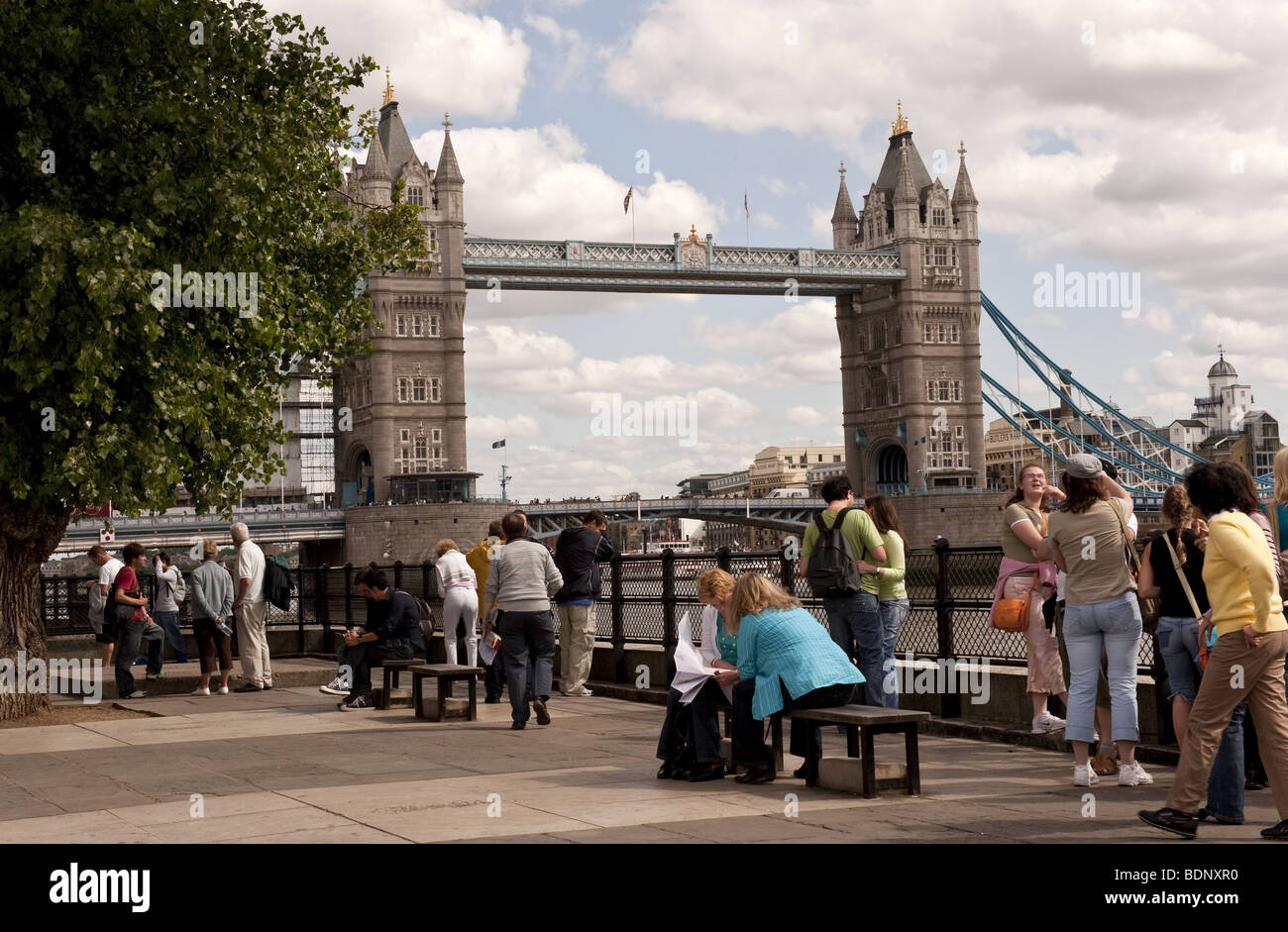 Tourists and visitors enjoying the famous landmark Tower Bridge ...