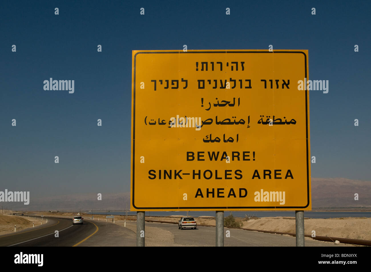 Warning sign sinkholes dead sea hi-res stock photography and images - Alamy