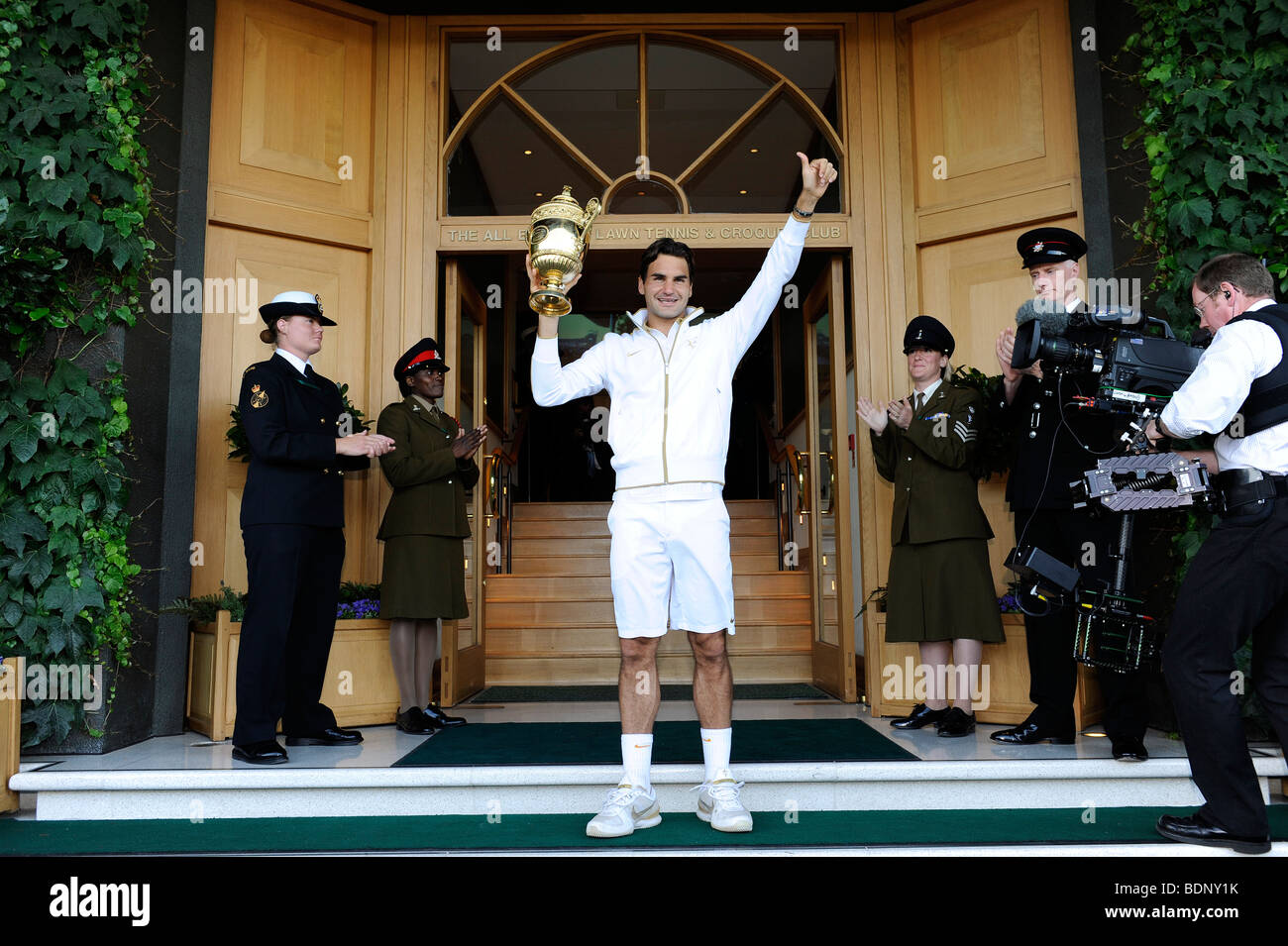Roger Federer celebrates with the trophy after winning the 2009 ...