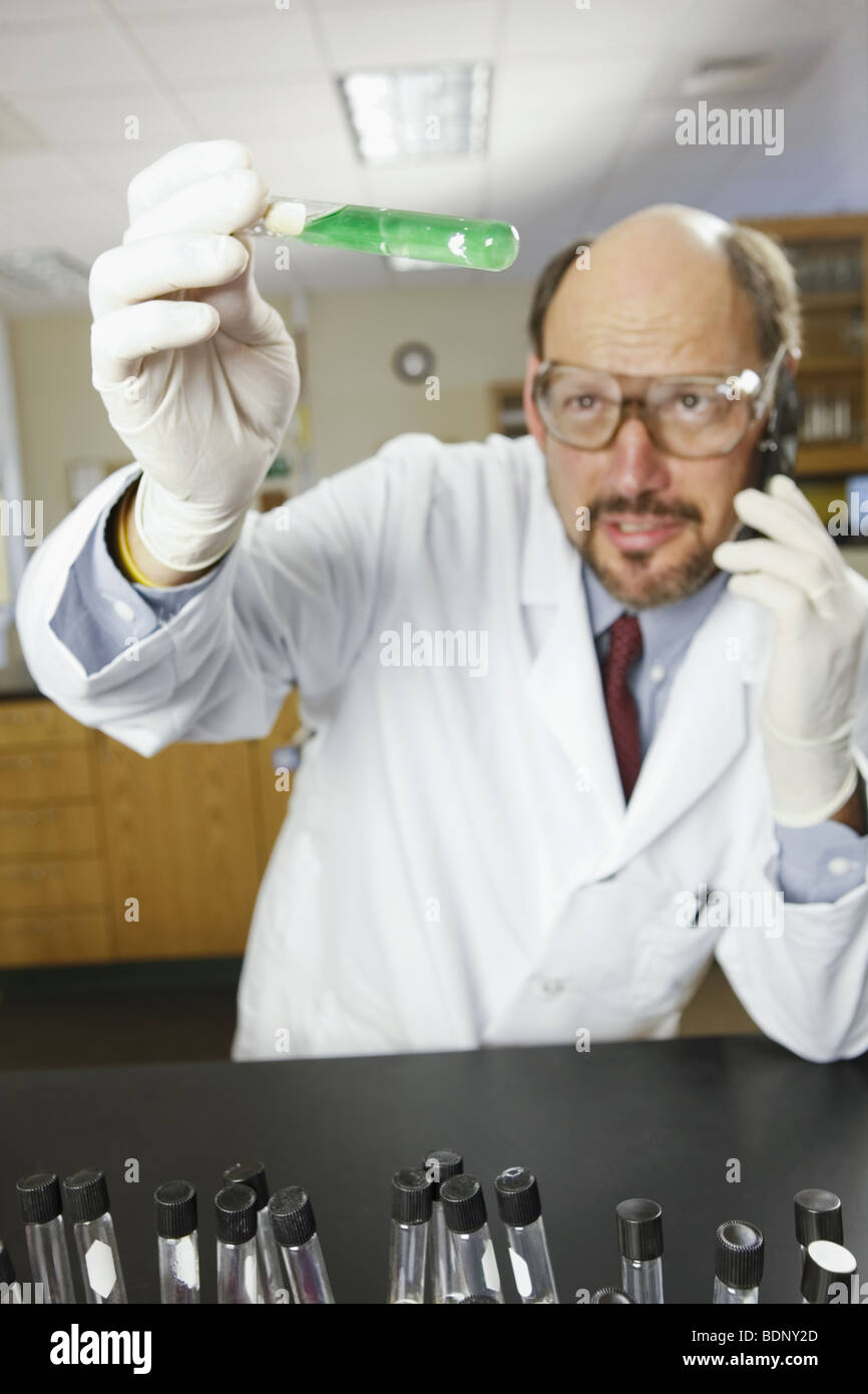 Scientist examining a bacteria sample in a test tube Stock Photo - Alamy