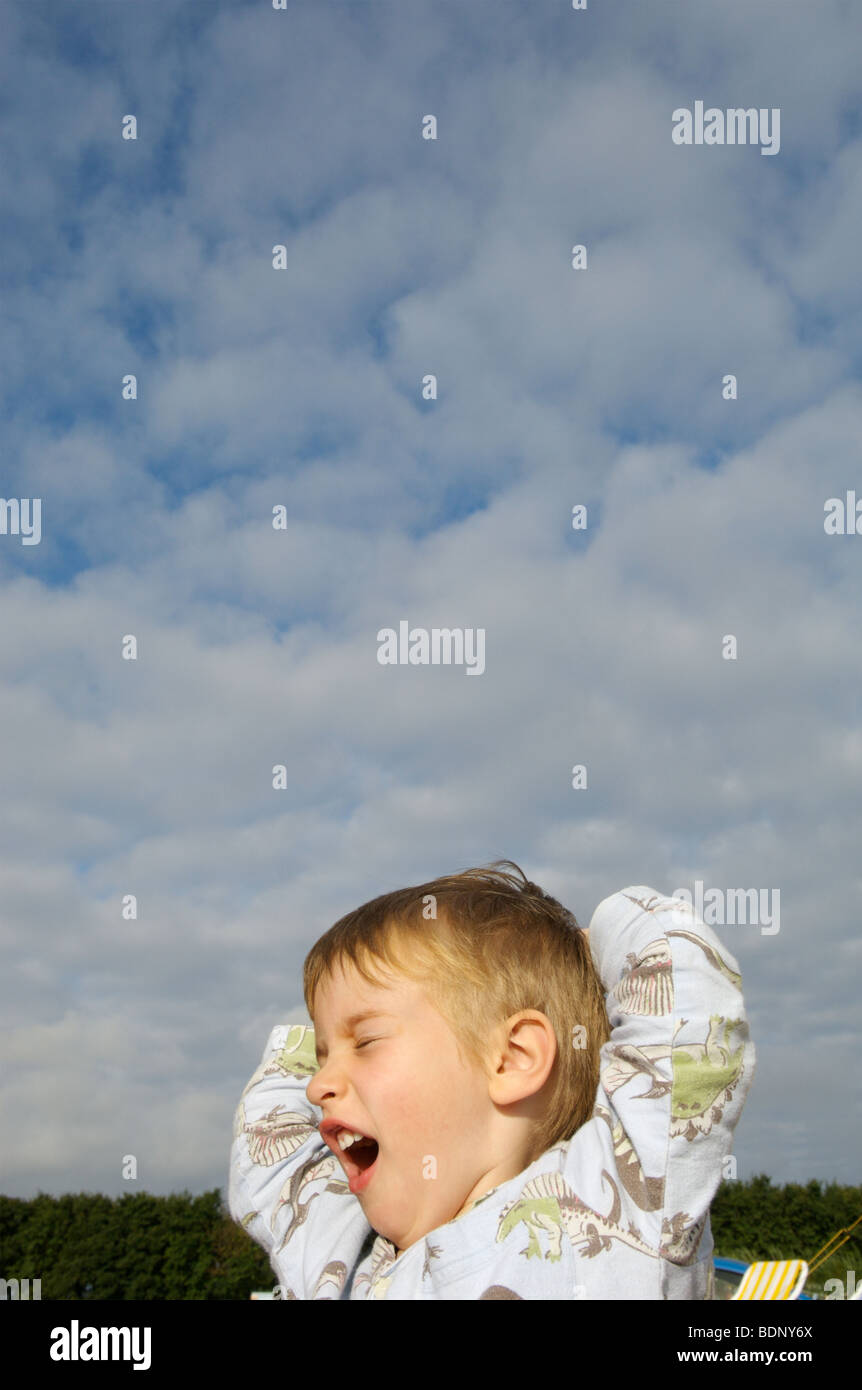 A young boy waking up Stock Photo - Alamy