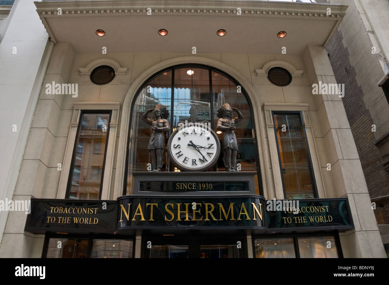 Entrance and large clock of the Nat Sherman tobacconist shop in 42nd ...