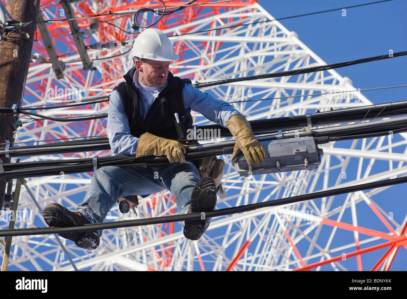 Cable lineman repairing distribution box Stock Photo - Alamy