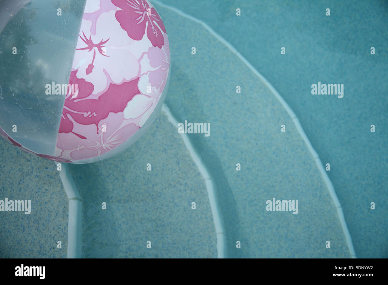 Ball in swimming pool Stock Photo - Alamy