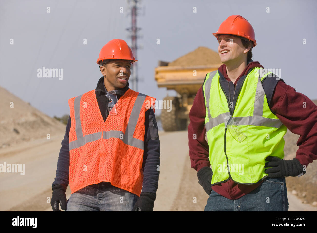Two engineers talking at a construction site Stock Photo - Alamy