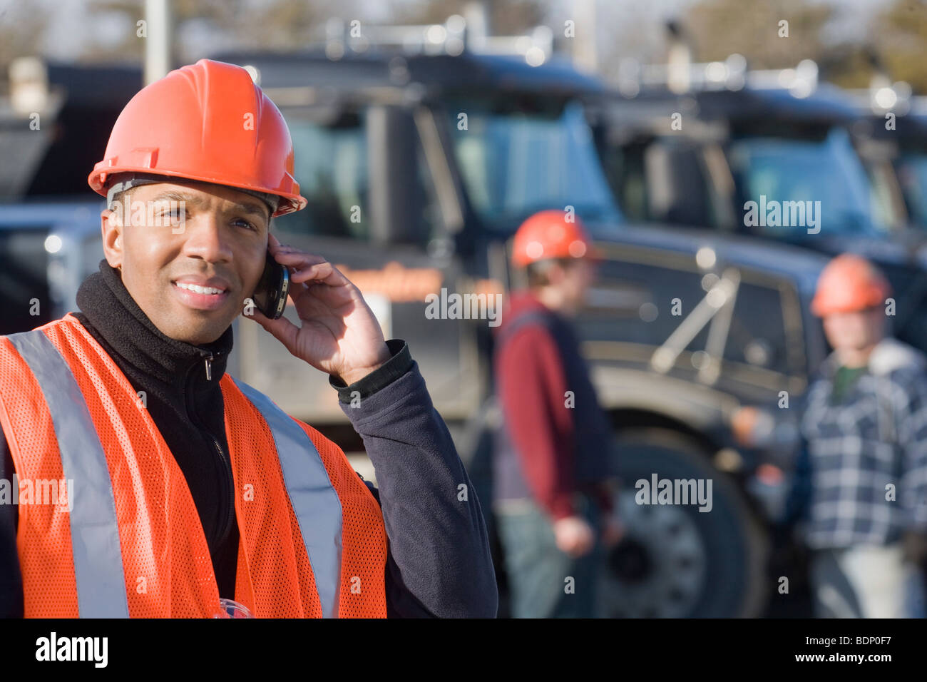 Engineer talking on a mobile phone Stock Photo - Alamy