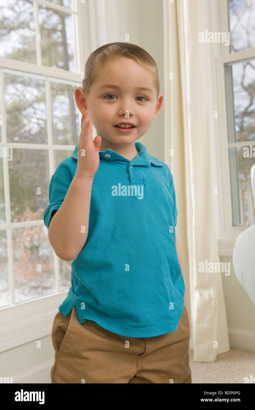 Boy signing the letter 'B' in American Sign Language Stock Photo - Alamy