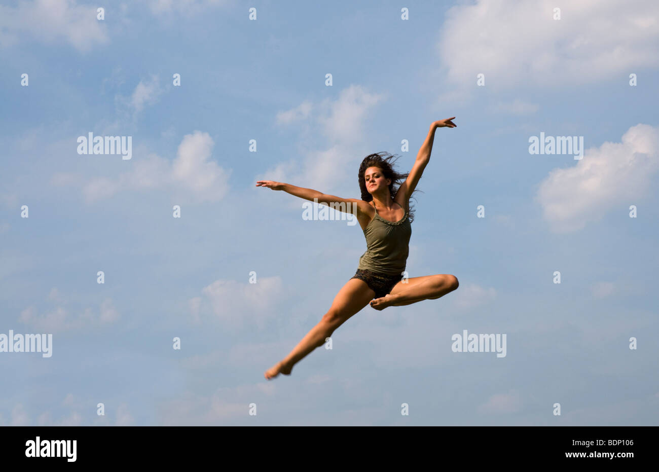 Beautiful teen girl doing ballet leap Stock Photo - Alamy