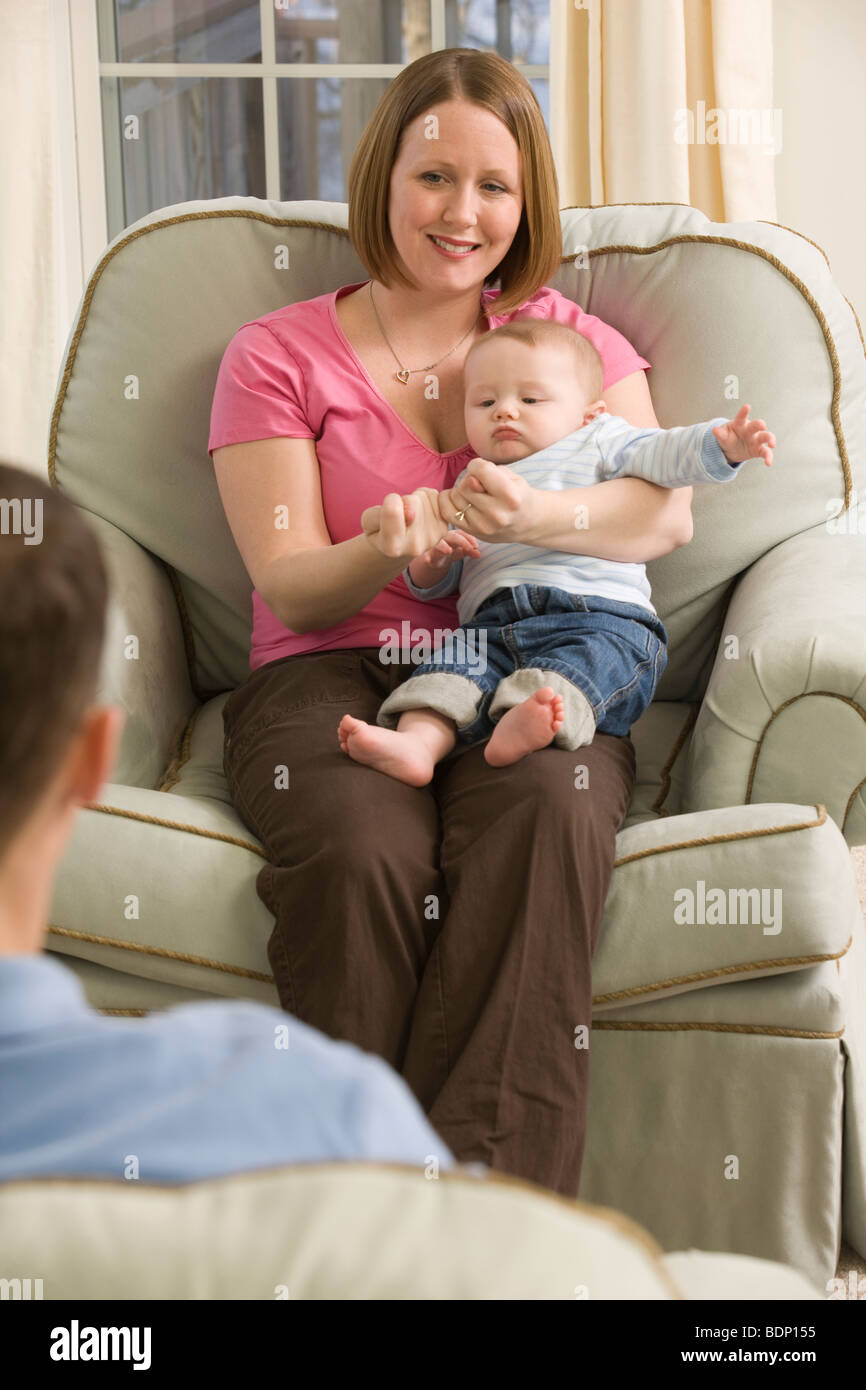 Woman signing the word 'Team' in American Sign Language while ...
