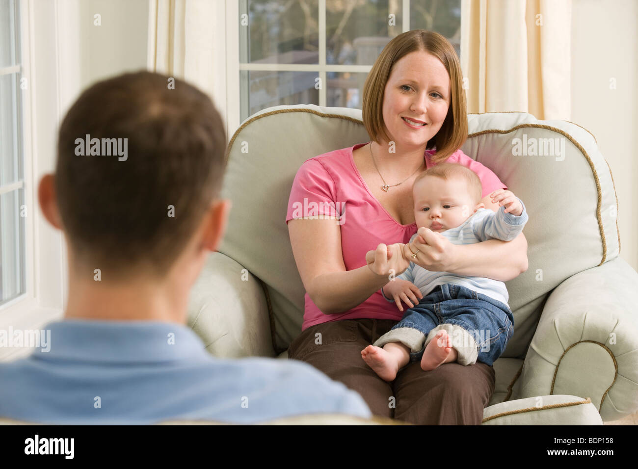 Woman signing the word 'Team' in American Sign Language while ...