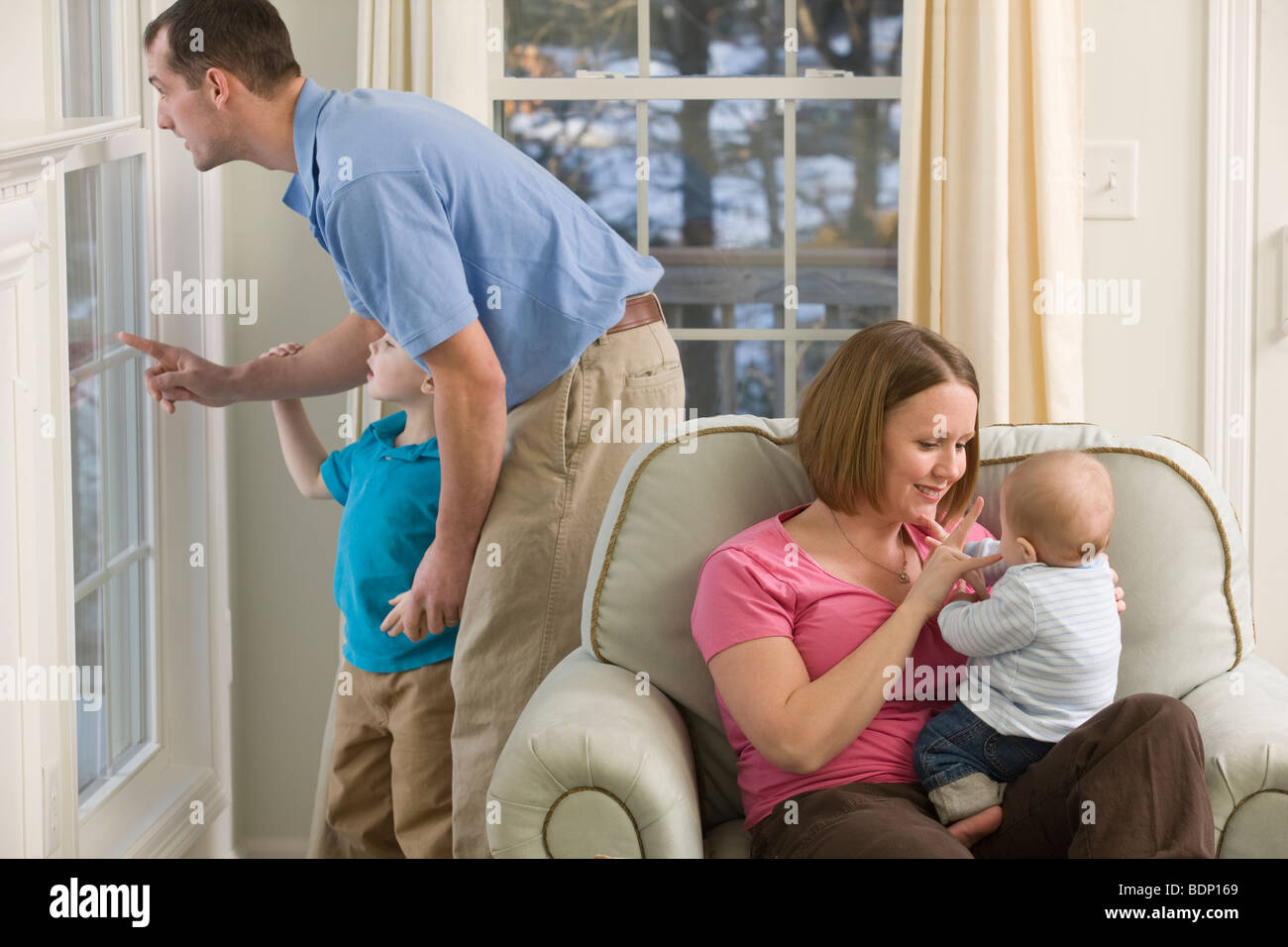 Woman signing the phrase 'I Love You' in American Sign Language while ...