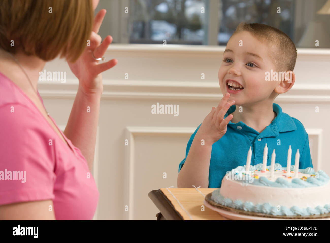 Woman signing the word 'Birthday' in American Sign Language while ...