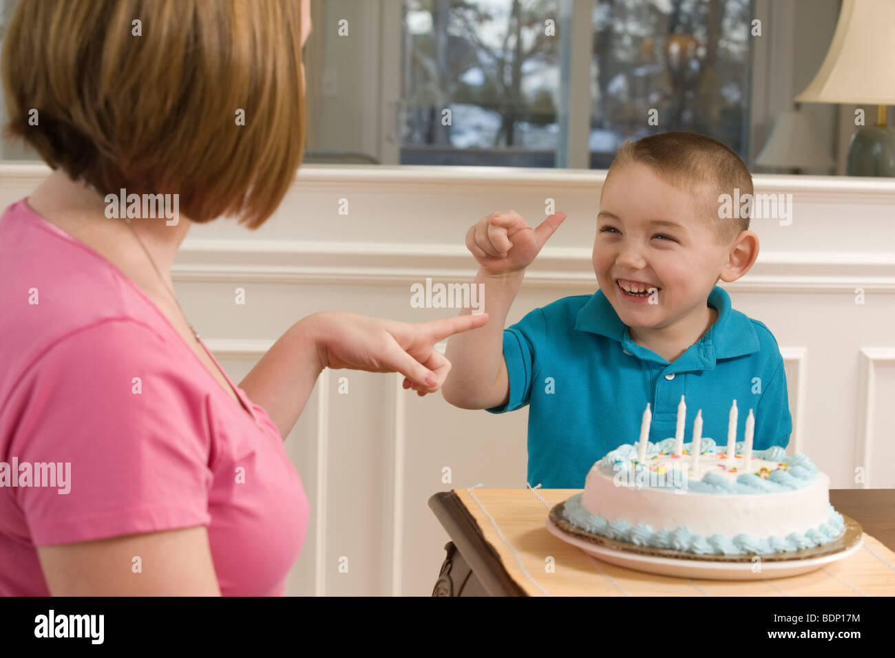 Woman signing the word 'You' in American Sign Language while ...