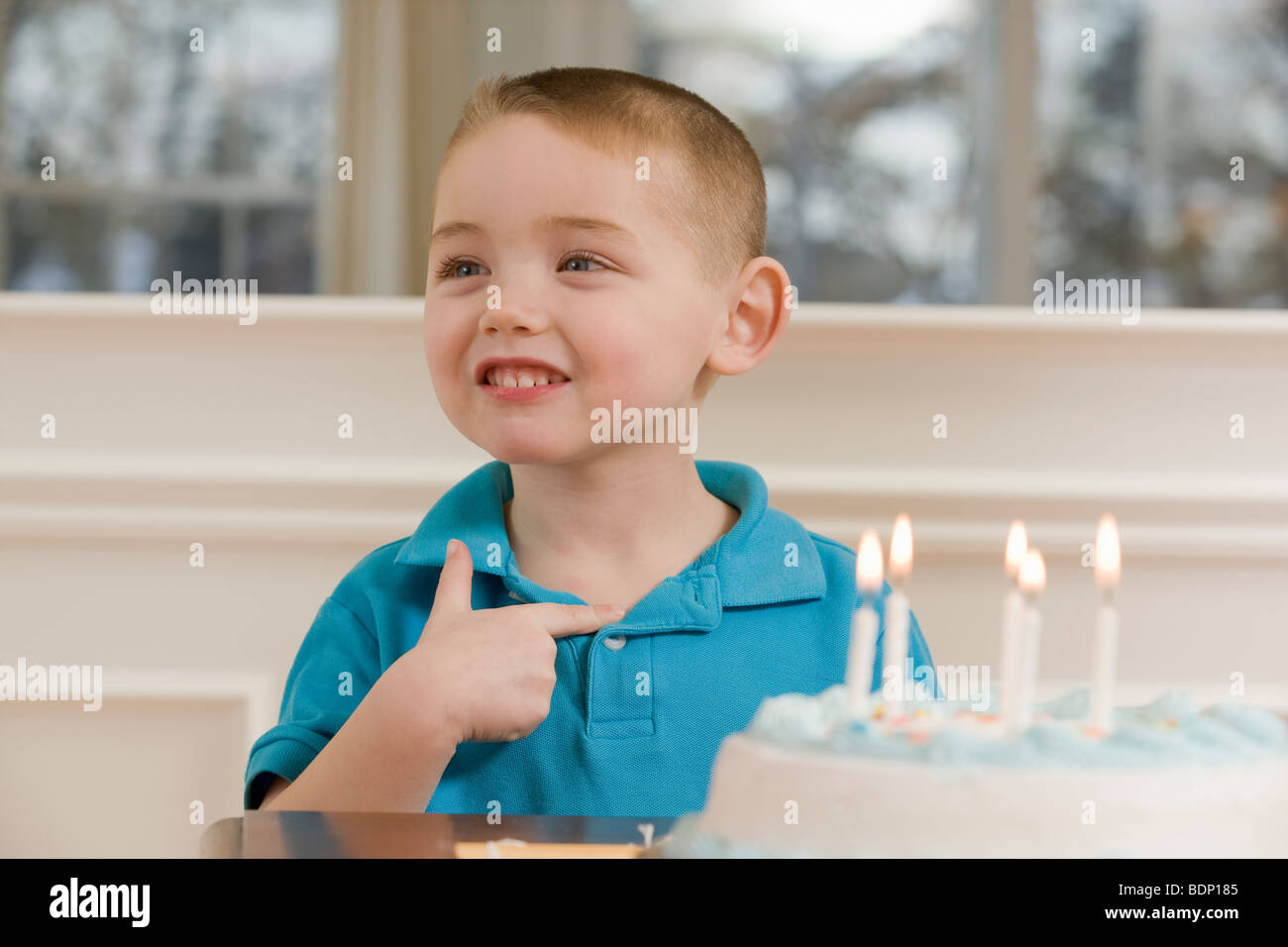 Boy signing the word 'Me' in American Sign Language Stock Photo - Alamy