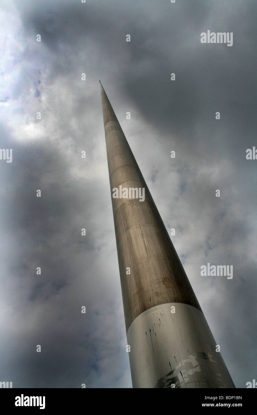 A spire pointing towards a cloudy sky Stock Photo - Alamy