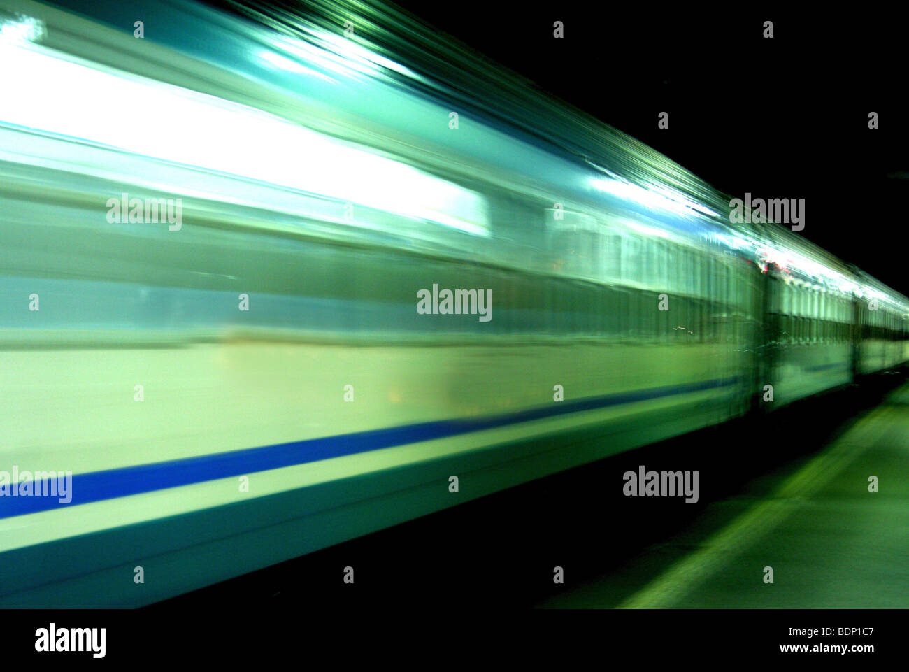A moving train near a platform Stock Photo - Alamy