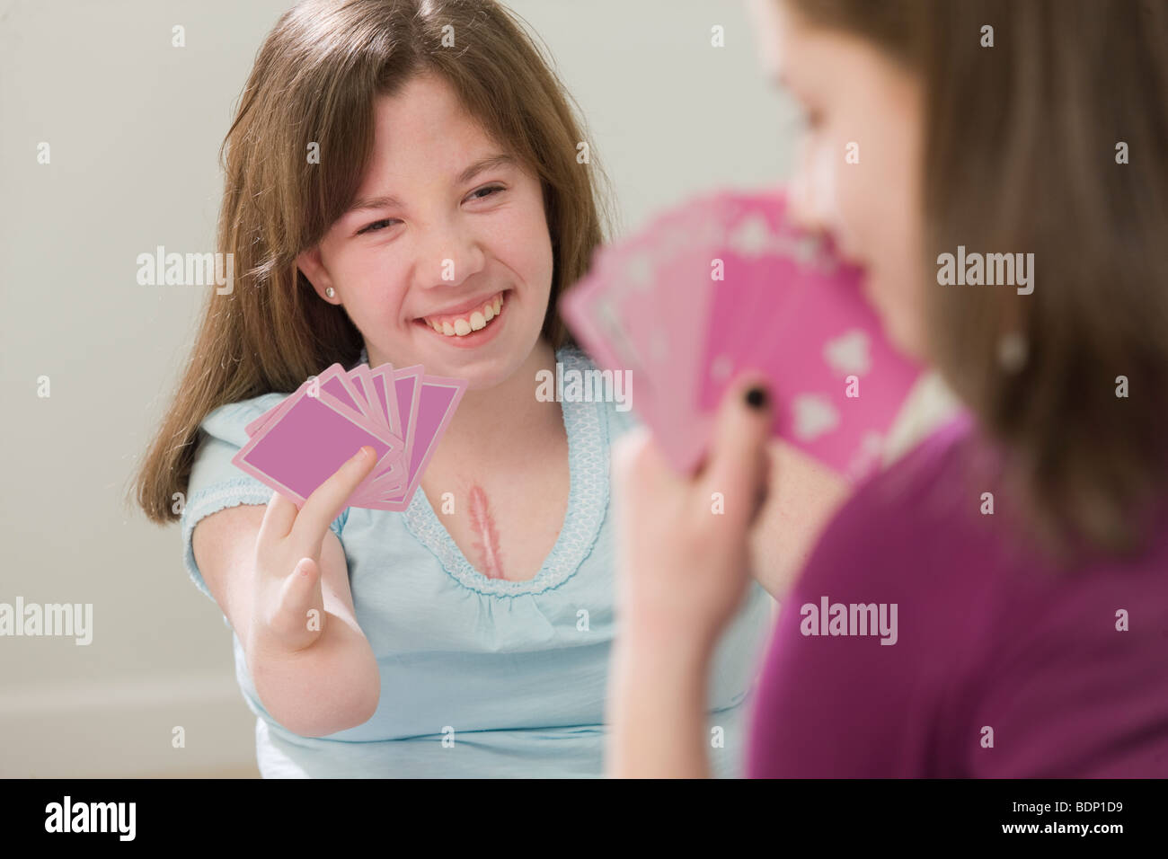 Two Girls Playing Cards High Resolution Stock Photography and Images ...