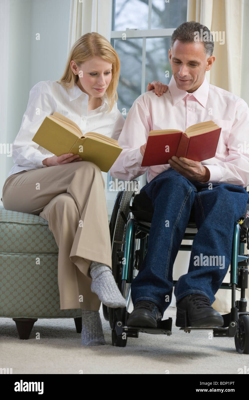 Couple reading books Stock Photo - Alamy