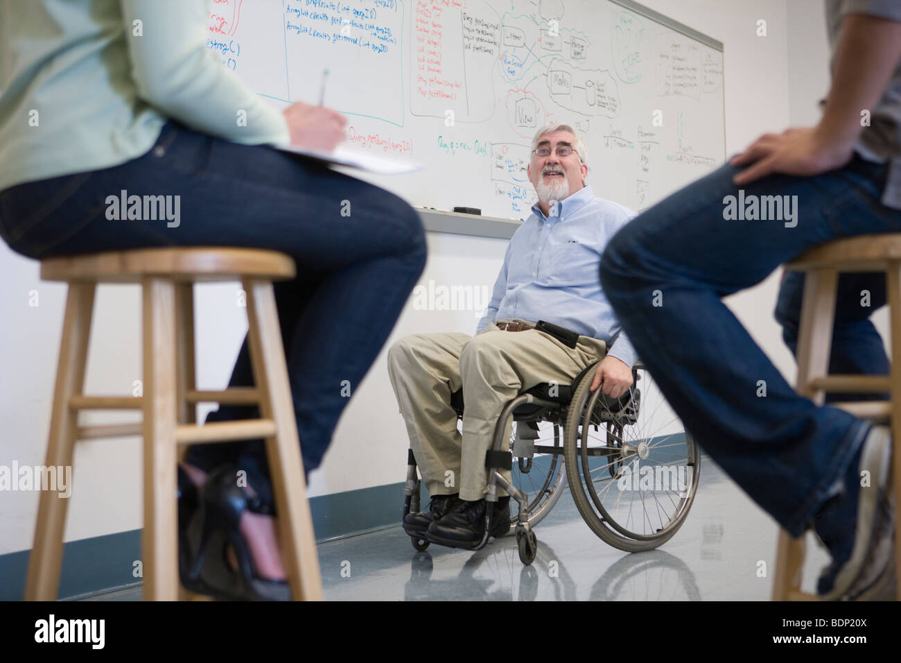 University professor teaching his students in a classroom Stock Photo ...