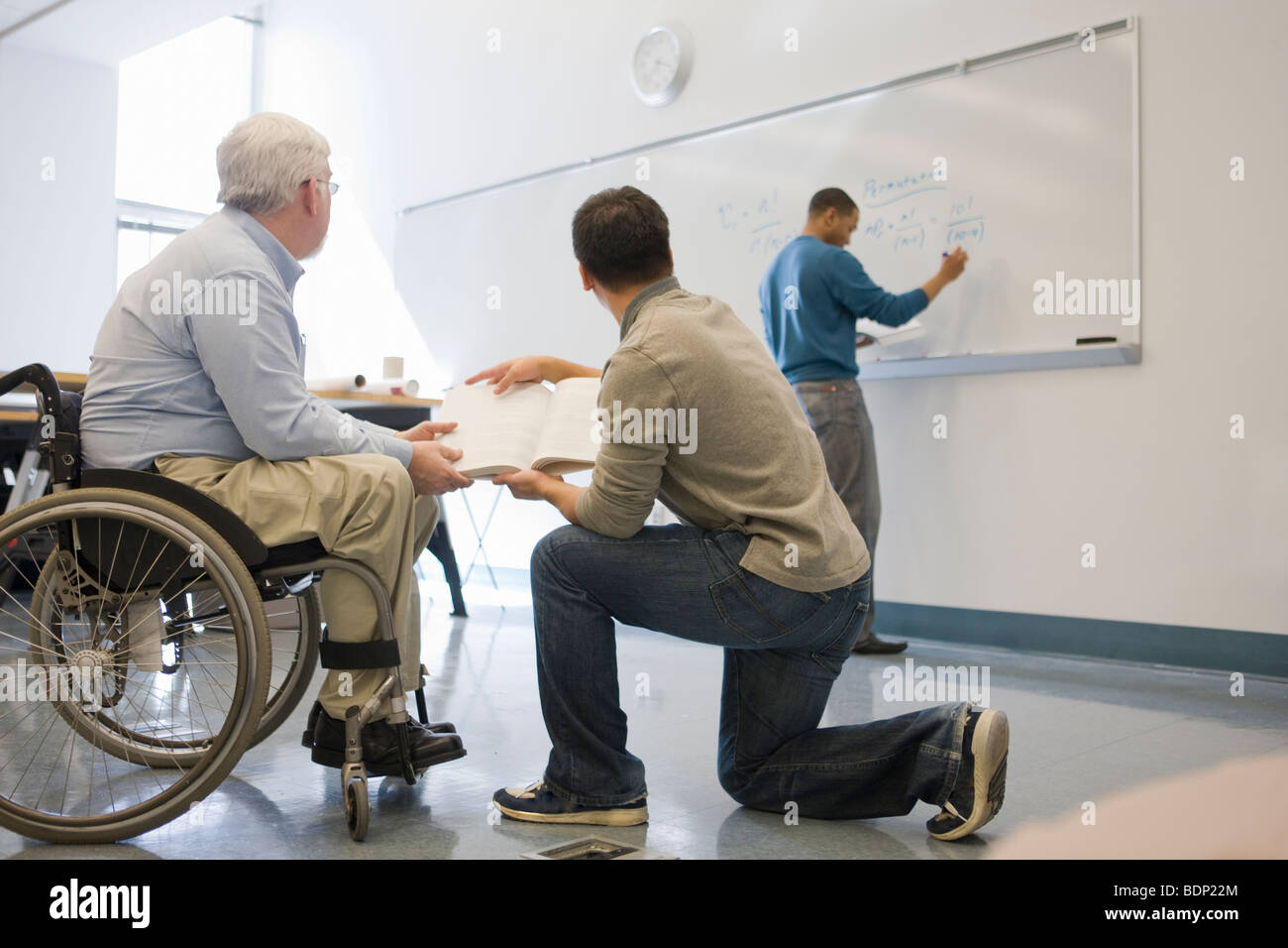 University professor teaching his students in a classroom Stock Photo ...