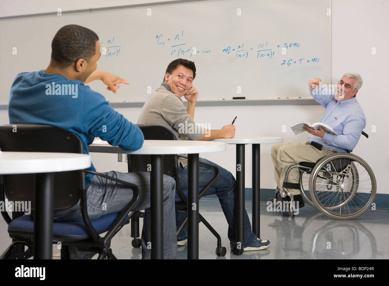 University professor pointing at a student in a classroom Stock Photo ...