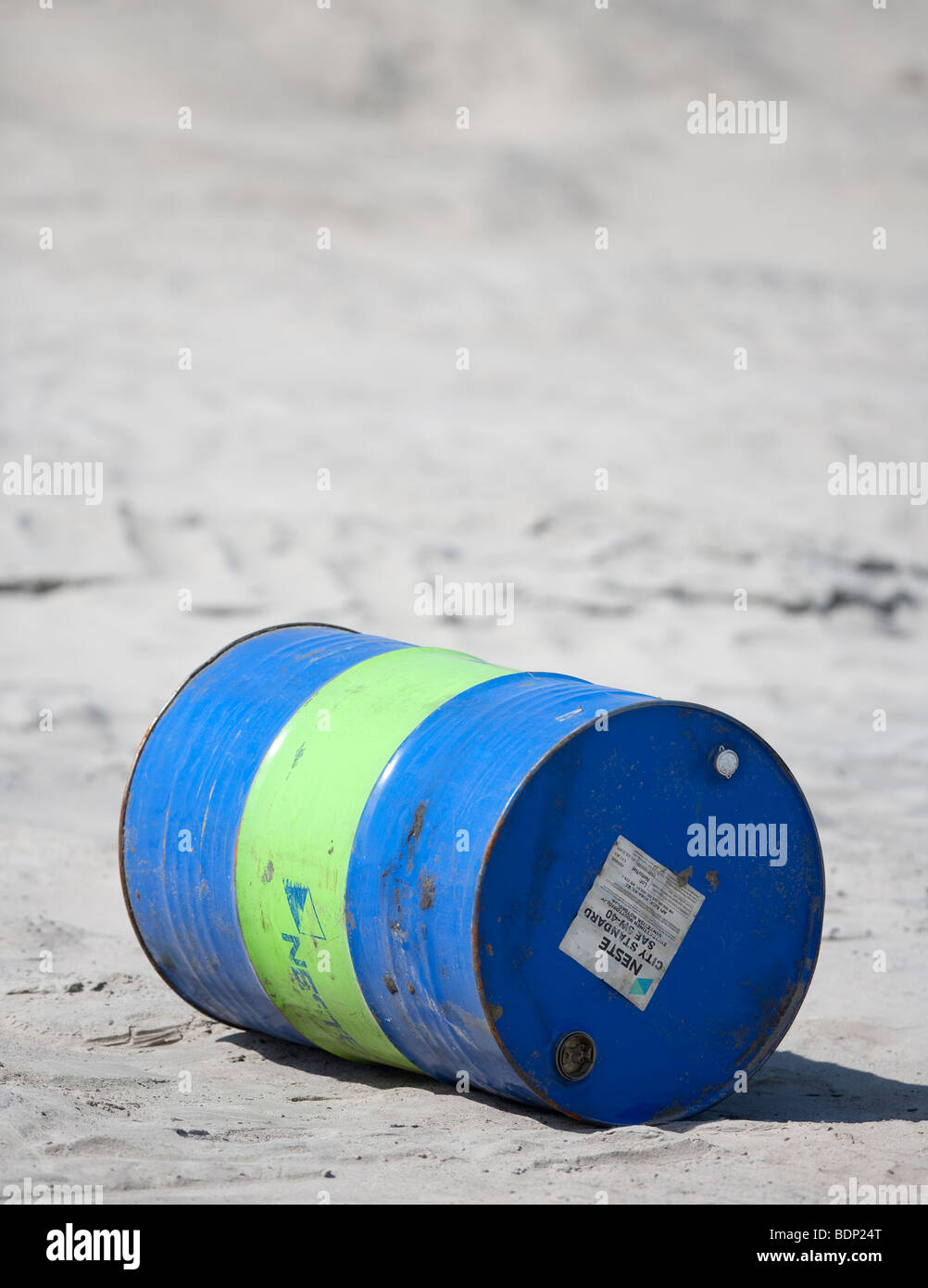 One lubricant oil barrel lying on sand Stock Photo - Alamy