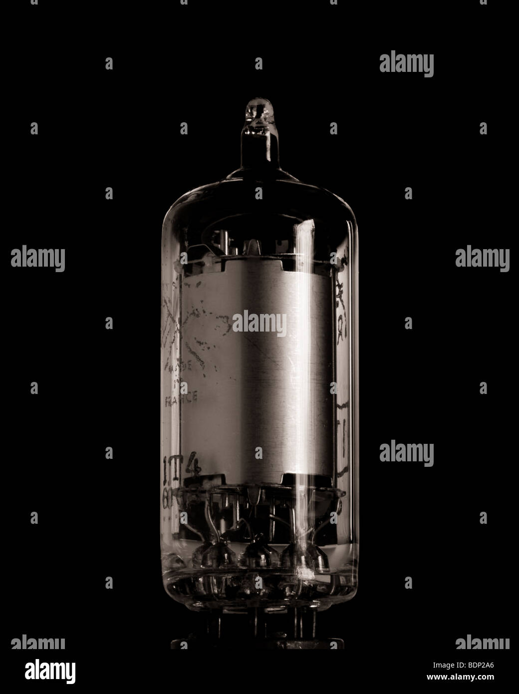 A 1T4 vacuum tube against a black background Stock Photo - Alamy