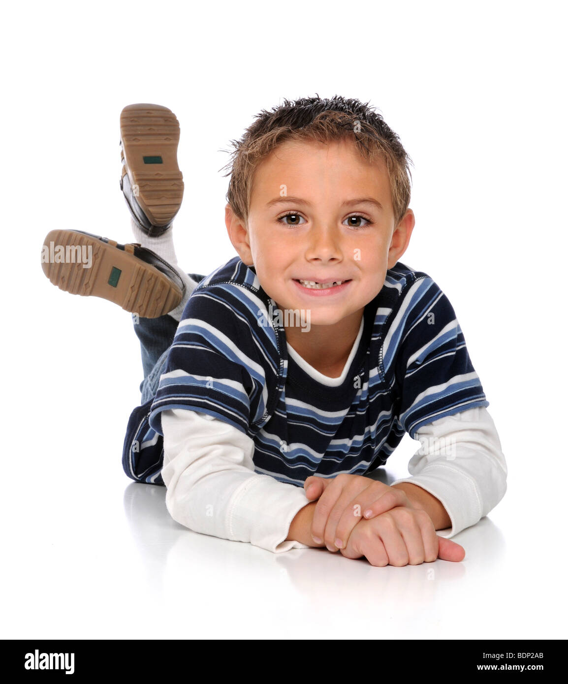 Young boy laying on the floor isolated over a white background Stock ...