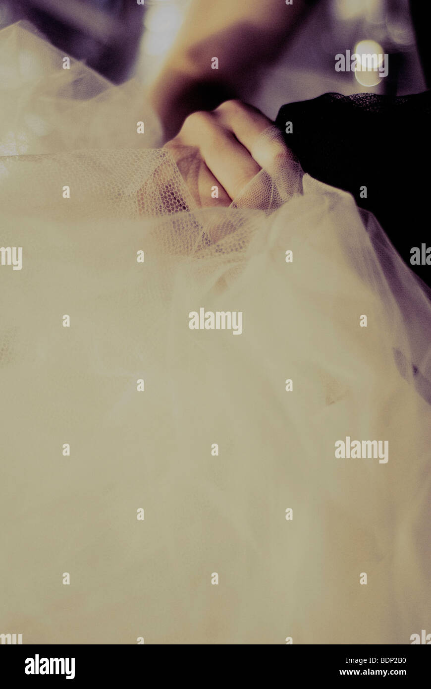 A hand holding netting Stock Photo - Alamy