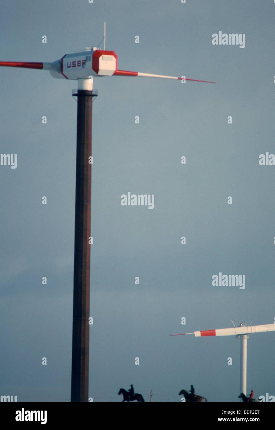 Coyboys on prairie in front of world's largest windmill, in Medicine ...