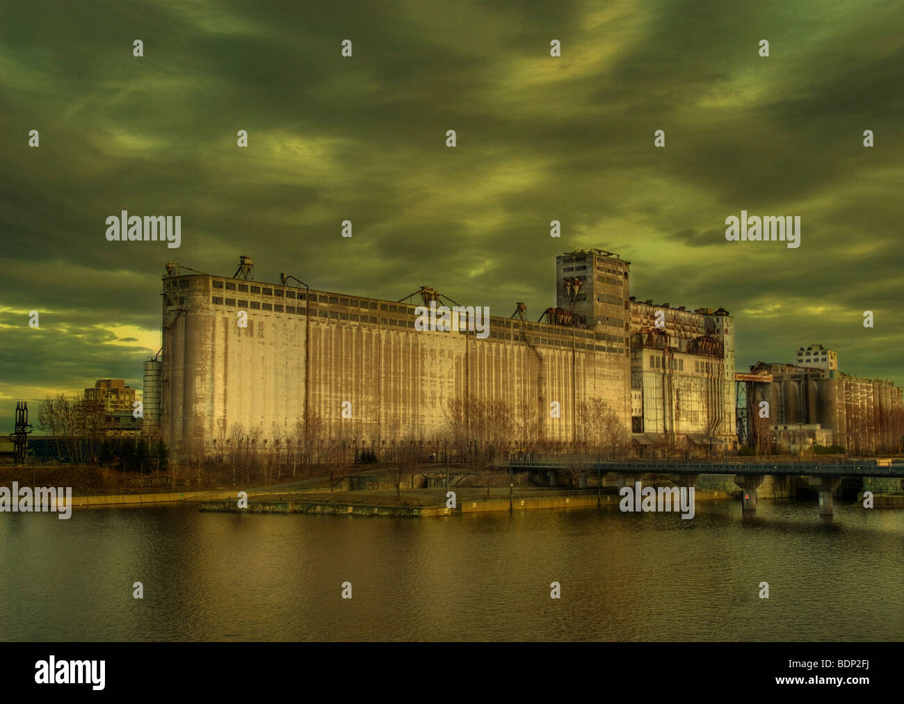 Industrial buildings near to water Stock Photo - Alamy
