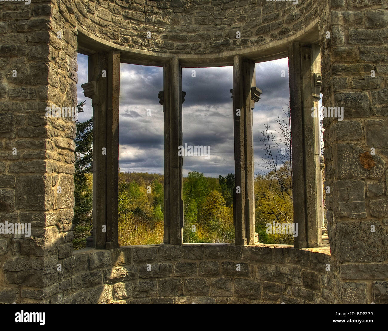 A bay window set in stoone walls overlooking the countryside Stock ...