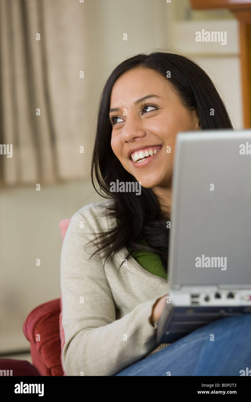 Hispanic woman working on a laptop Stock Photo - Alamy