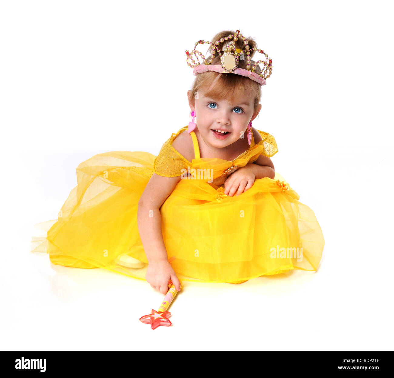 Little girl dressed as a princess in a yellow dress Stock Photo - Alamy
