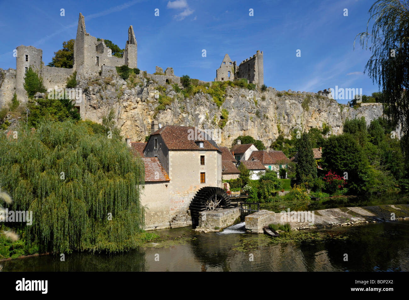 Old watermill and medieval chateau ruins in the town of Angles sur l ...