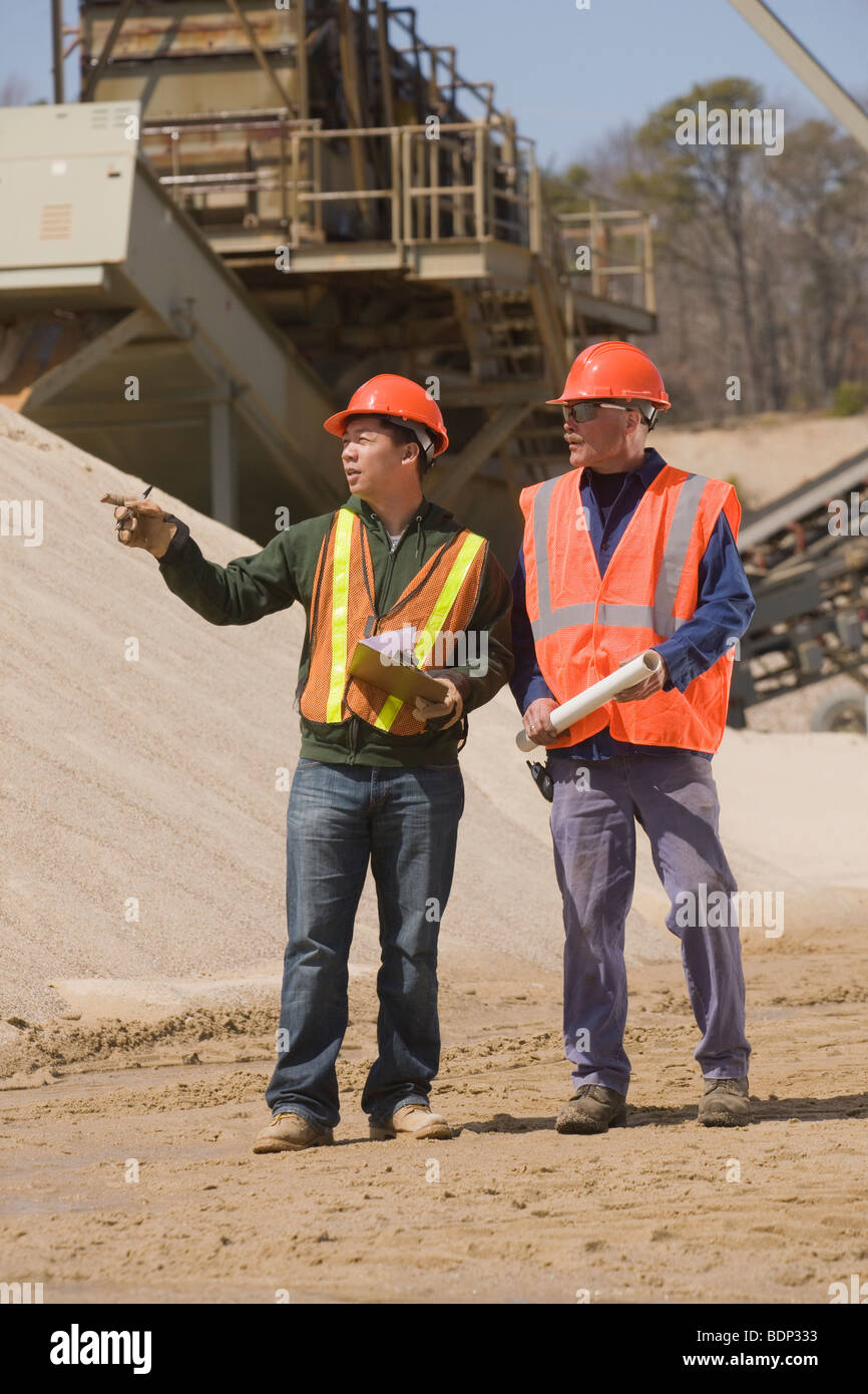 Two engineers planning at a plant Stock Photo - Alamy