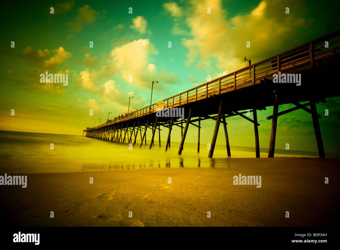 A timber jetty under a blue Stock Photo - Alamy