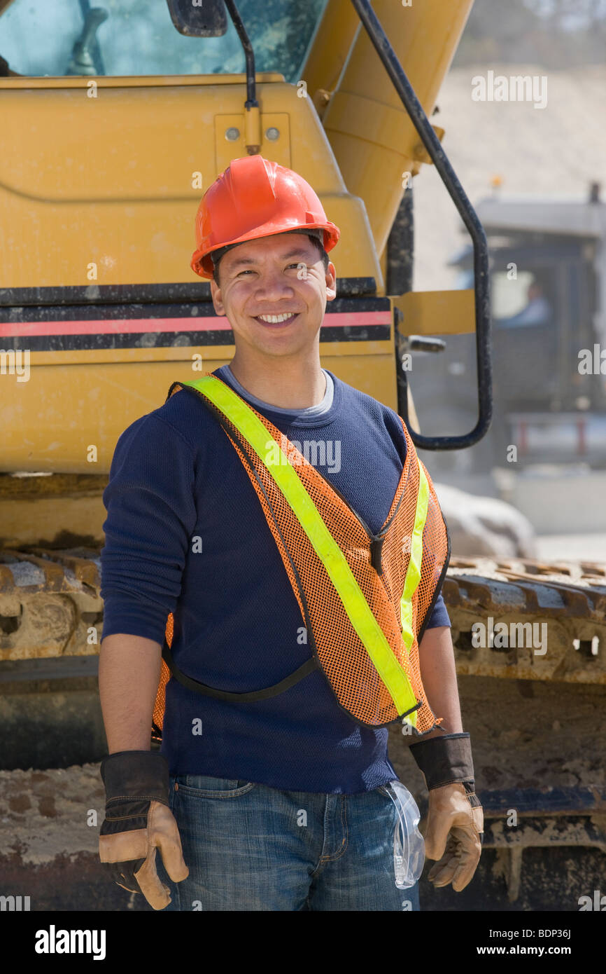 Portrait of a engineer smiling at a plant Stock Photo - Alamy
